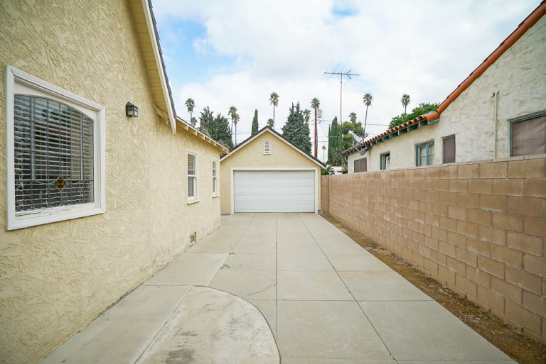 Long driveway with no house overhang will accommodate RVs and/or extra ...