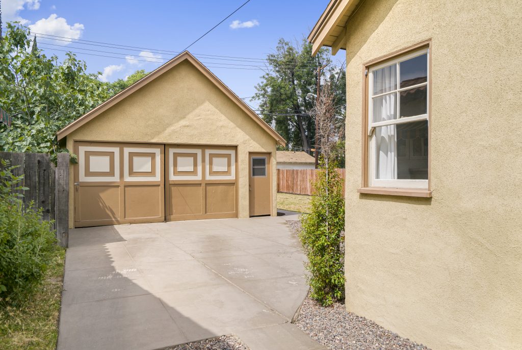 Hollywood driveway leading to detached 2-car garage with original-style ...